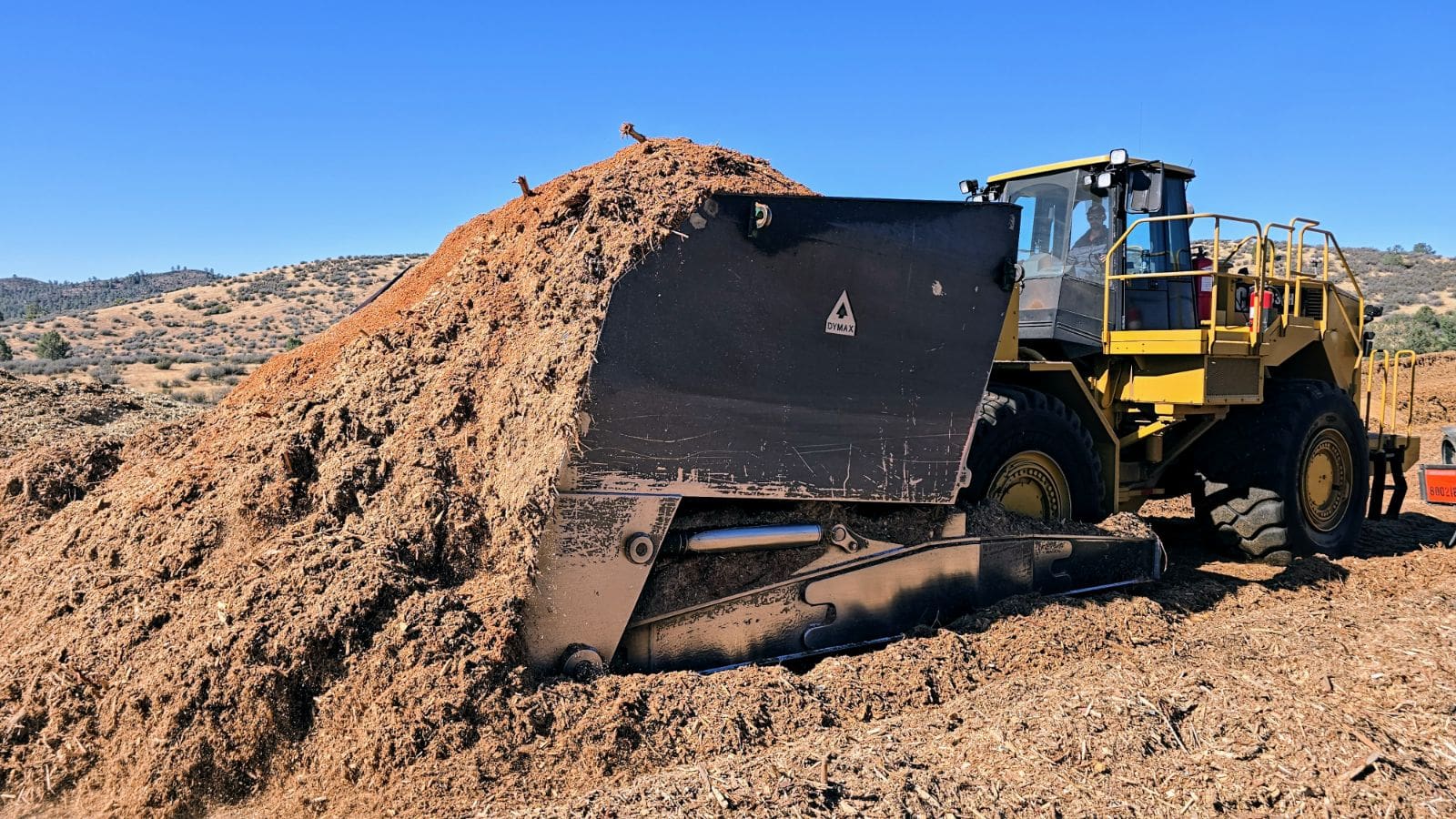 Wood Chip Scoop for Power Plants | Dozer Attachment | Dymax Inc